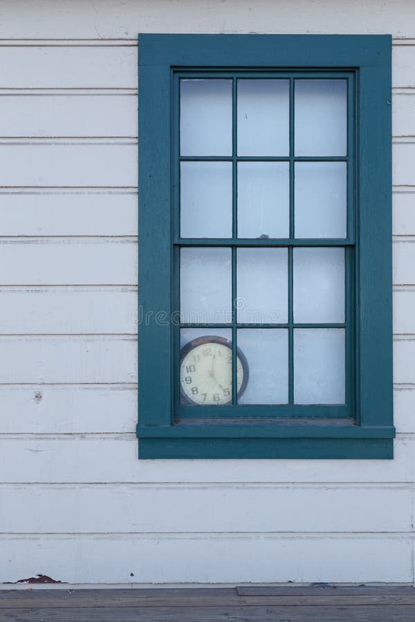 Old Clock behind Window stock photo. Image of buildings - 48829524