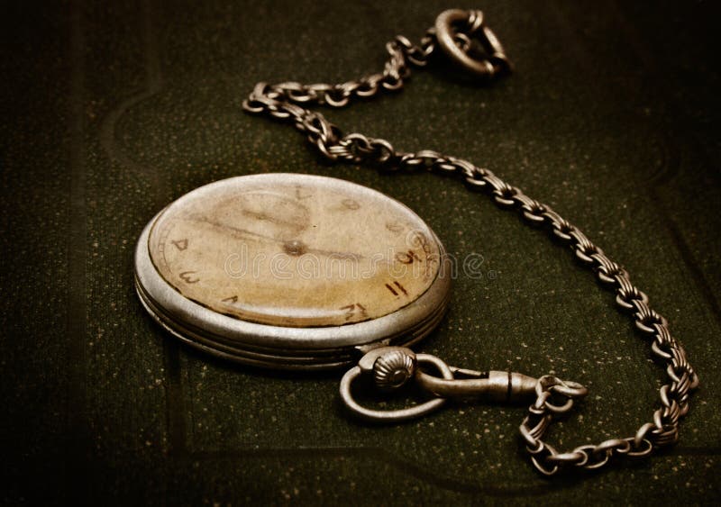 Old Clock with Chain Lying on Rough Green Surface Stock Photo - Image ...
