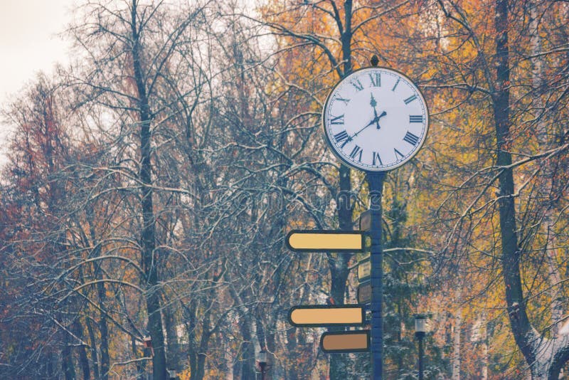 Old Clock with an Guide Arrows Stock Photo - Image of autumn, retro ...
