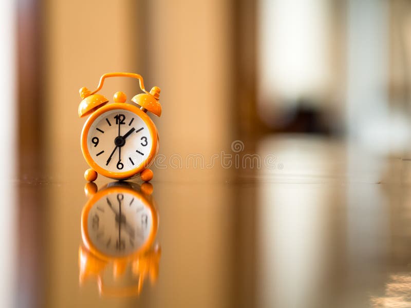 Old Clock Orange on the Wooden Table, Stock Image - Image of isolated ...
