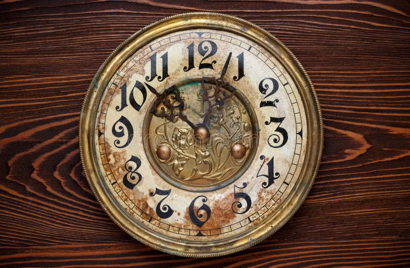 Old Clock with a Rusty Clock Face on Wooden Background Stock Image ...