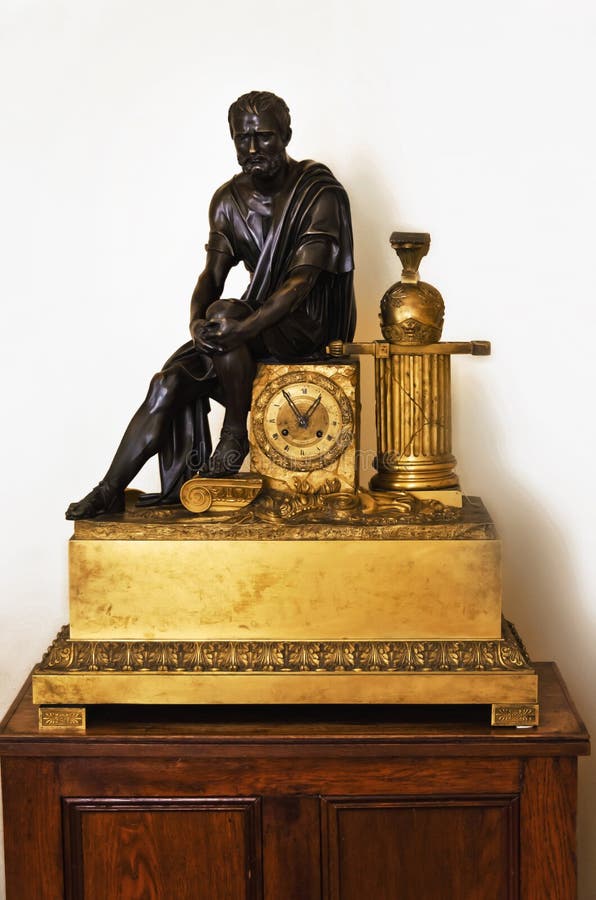 Old clock and statue stock image. Image of oldfashioned - 36529343