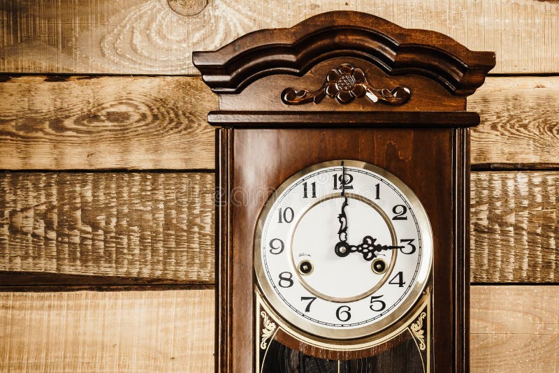 Old clock on a wooden wall stock image. Image of design - 84485421
