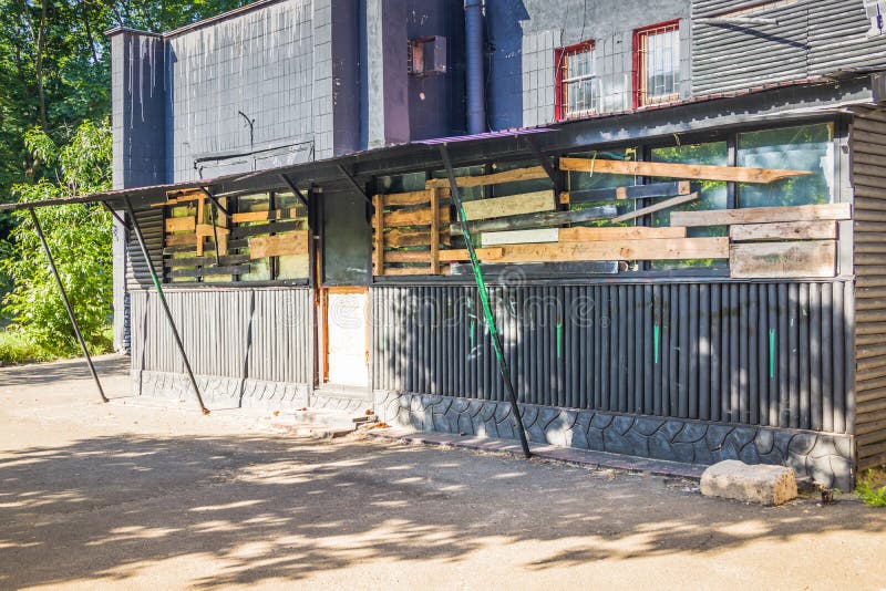 Old Closed Black Shop with Boarded Up Windows Stock Image - Image of ...