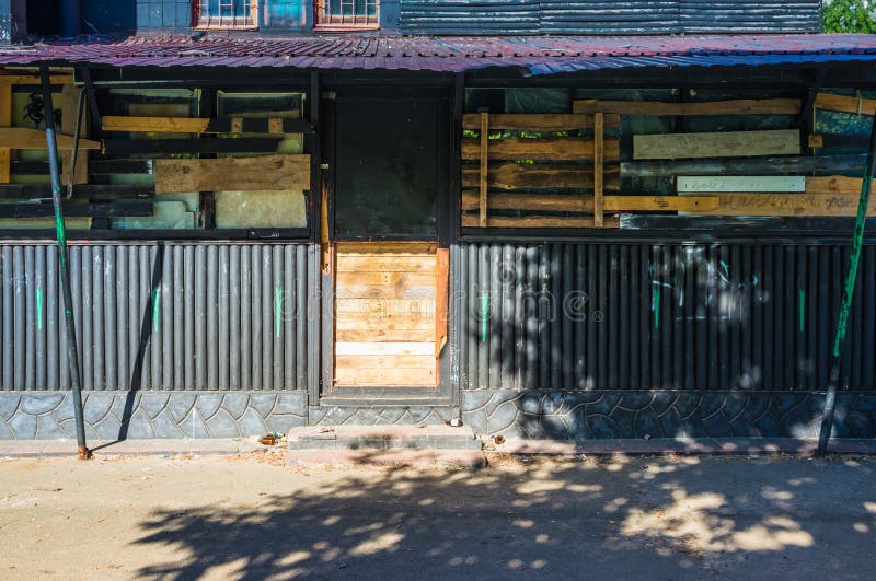 Old Closed Black Shop with Boarded Up Windows Stock Photo - Image of ...