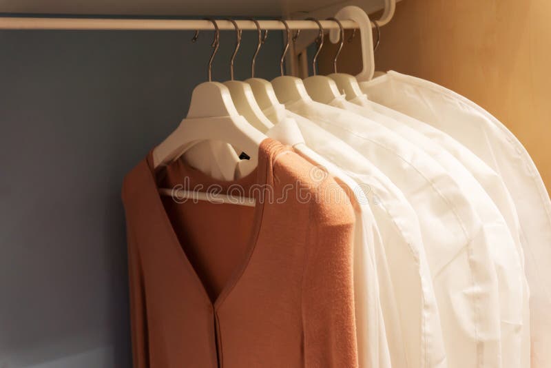 Old Clothes in a Closet on Hangers. Old-fashioned Things in the ...