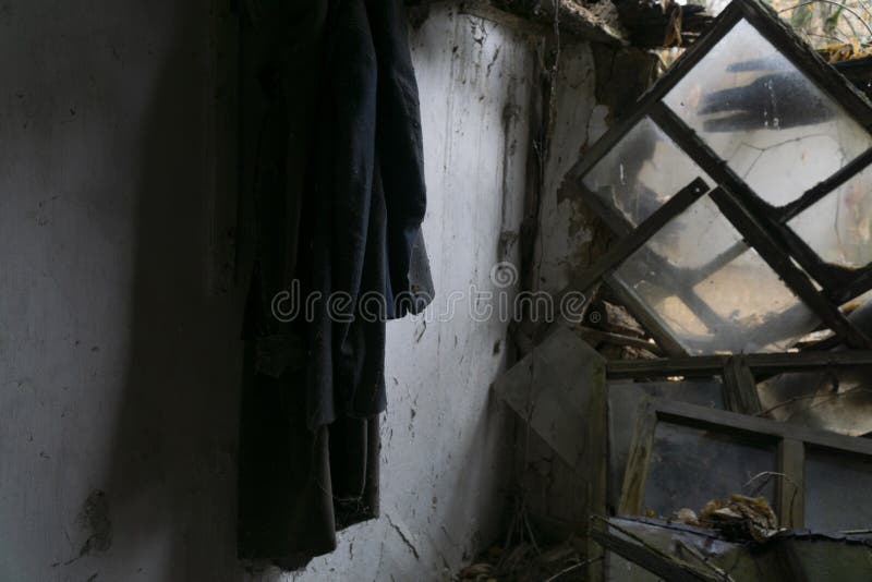 An Old Clothes and Rusty Elements Inside an Abandonated House at ...