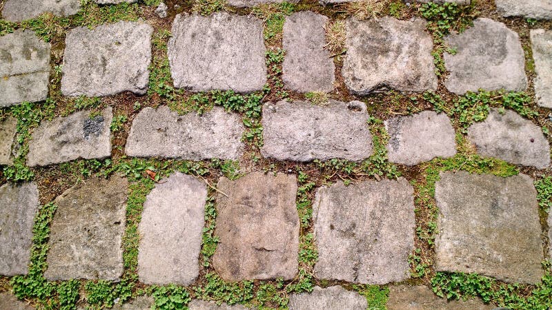 Old cobblestone footpath stock image. Image of sunlight - 79637631