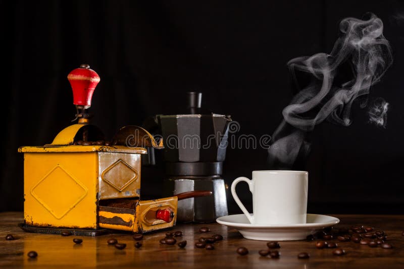 Old Coffee Grinder Next To an Espresso Machine and a Cup of Steaming ...