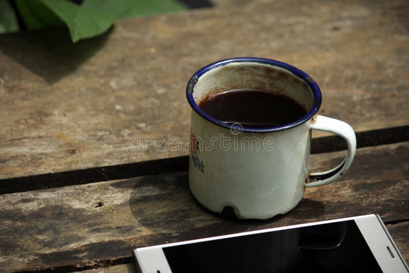An Old Coffee Mug stock image. Image of black, wood - 188590025