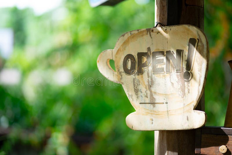 An Old Coffee Shop Opening Sign in the Morning Light Stock Image ...