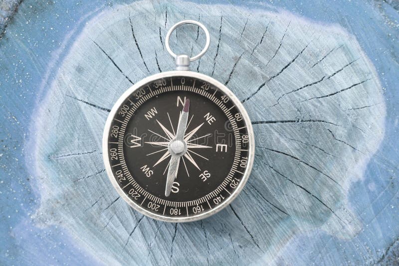 Compass on blue background stock photo. Image of adventure - 185540678