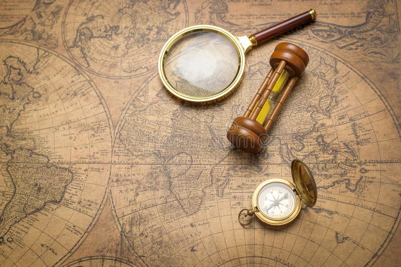 Old Compass , Magnifying Glass and Sand Clock on Vintage Map Stock ...