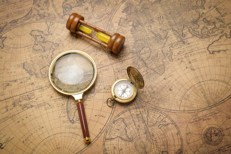 Old Compass , Magnifying Glass and Sand Clock on Vintage Map Stock ...