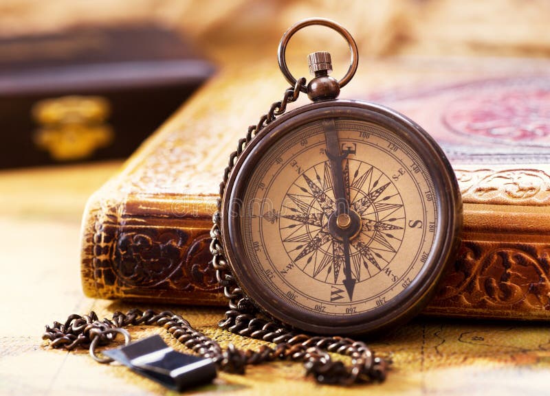 Compass sign at sunset stock image. Image of graved, grave - 24719059