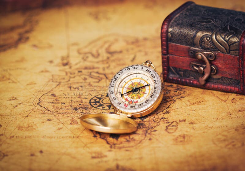 Old Vintage Compass with Treasure Chest on Map. Stock Photo - Image of ...