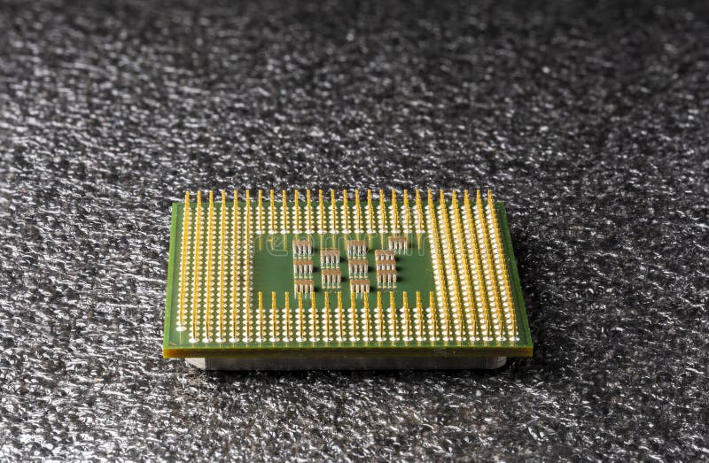 Old Computer Processor with Gold-plated Legs, Microcircuits on it, on a ...