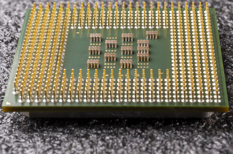 Old Computer Processor with Gold-plated Legs, Microcircuits on it, on a ...