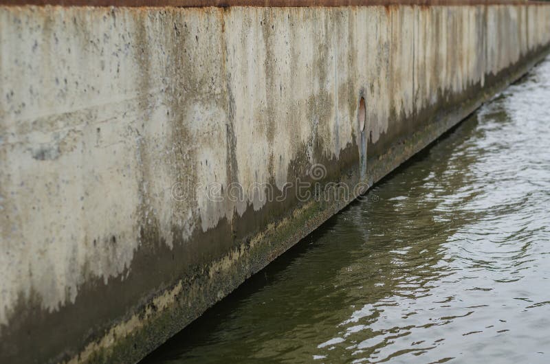 Old Concrete Pier, Water Side View. Close-up of the Gray Vertica Stock ...
