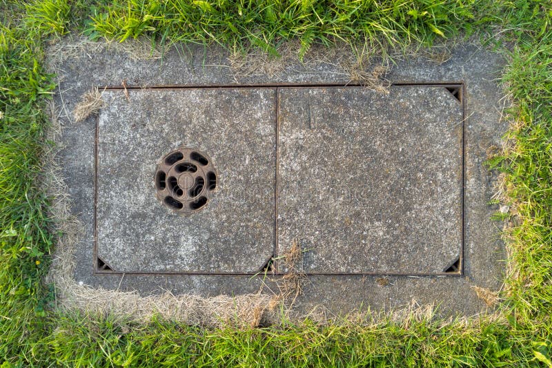 Old Concrete Utility Cover with Grass Stock Image - Image of water ...