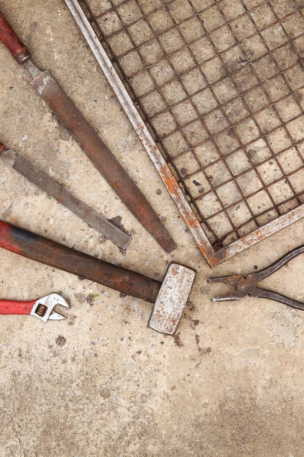 Old Construction Tools Laid Out on a Concrete Background Stock Photo ...