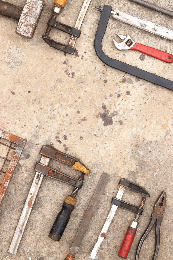 Old Construction Tools Laid Out on a Concrete Background, Top View ...