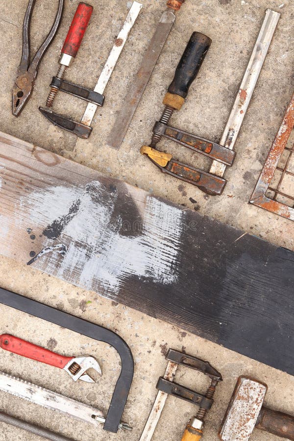 Old Construction Tools Laid Out on a Concrete Background, Top View ...