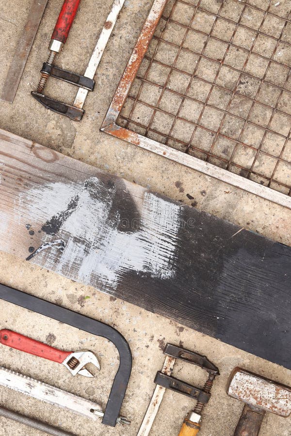 Old Construction Tools Laid Out on a Concrete Background, Top View ...