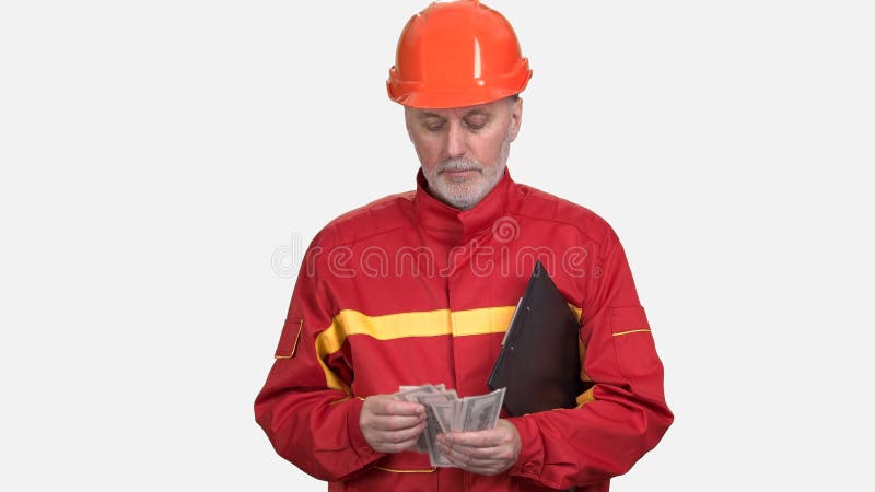 Old Construction Worker in Red Uniform Counts Money. Stock Footage ...