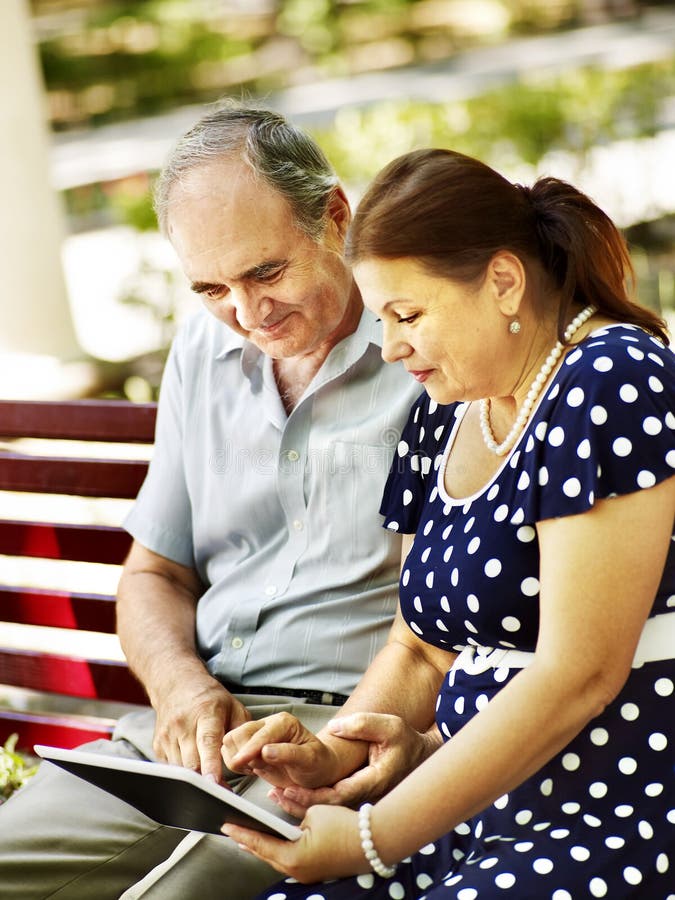 Old Couple with Tablet Pc Sit on Bench . Stock Image - Image of nature ...