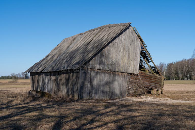 Old Crooked Barn in the Field Stock Photo - Image of structure, shadows ...
