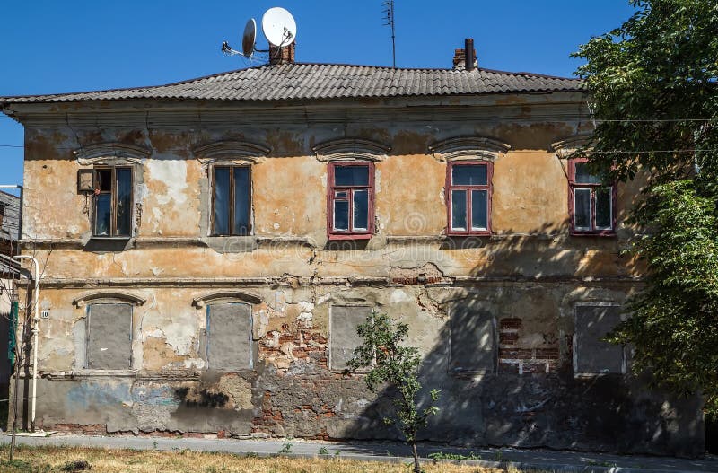 Old Crumbling Building with Satellite Dish on the Roof. Stock Image ...