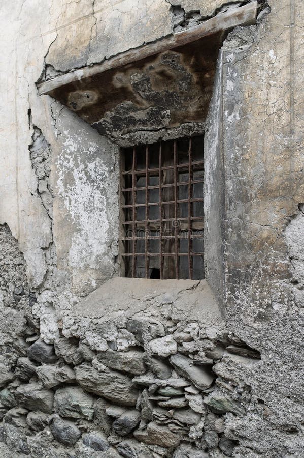Old Crumbling Wall with Barred Window and Stone Foundation Stock Image ...