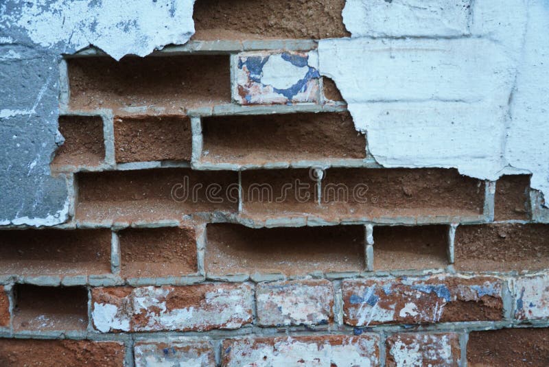 An Old Crumbling Wall with Destroyed Bricks between a Strong Masonry ...
