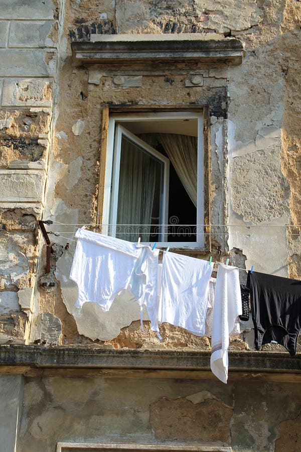 Old, Crumbling Wall, Open Window in an Old Building, Laundry Hanging on ...