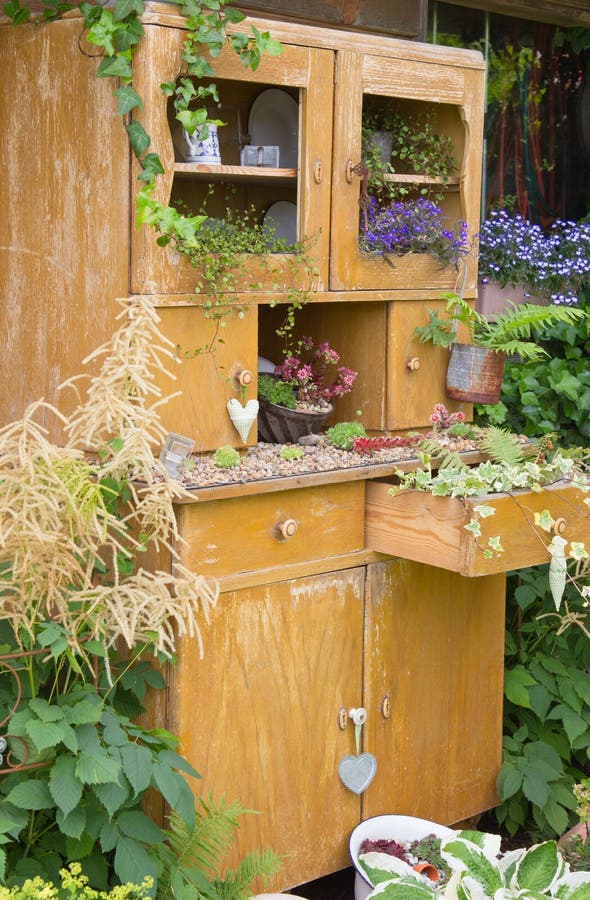 Garden Furniture Set with Flowers Growing in Garden Stock Image - Image ...
