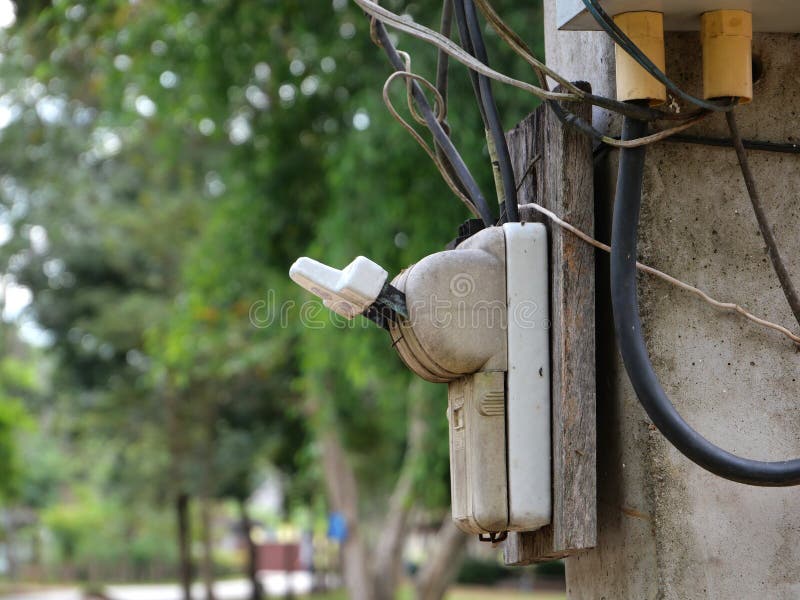 Household Electrical Outlet with a Broken Electrical Plug Inside. Bare ...