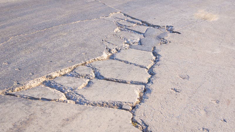 The Old Damaged Concrete Road with Broken Crack Lines and Collapsed ...
