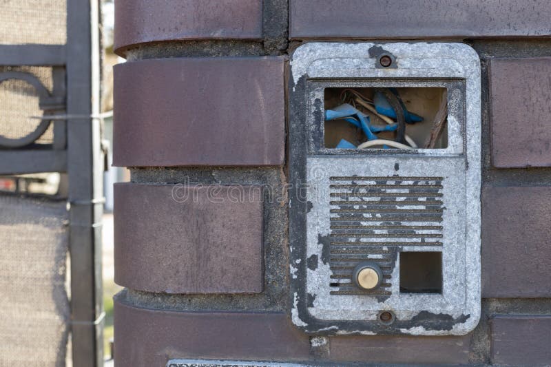 Old Damaged Intercom with Exposed Wires on Brick Wall Stock Image ...