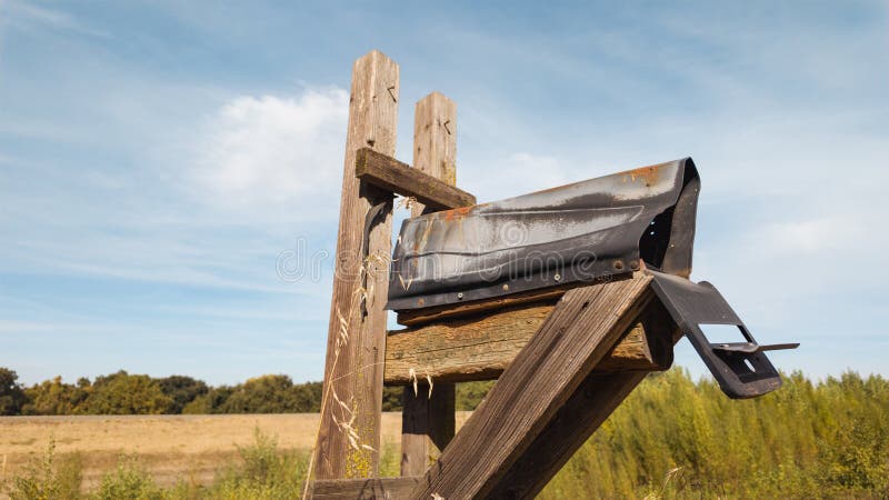 Old Damaged Mailbox with Dry Grass in Field Stock Photo - Image of ...