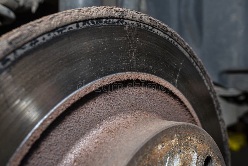 Old and Damaged Rear Brake Discs with Caliper and Brake Pads in the Car ...