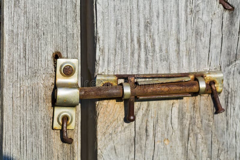Old Deadbolt on Wooden Door Stock Image - Image of iron, safe: 199802031