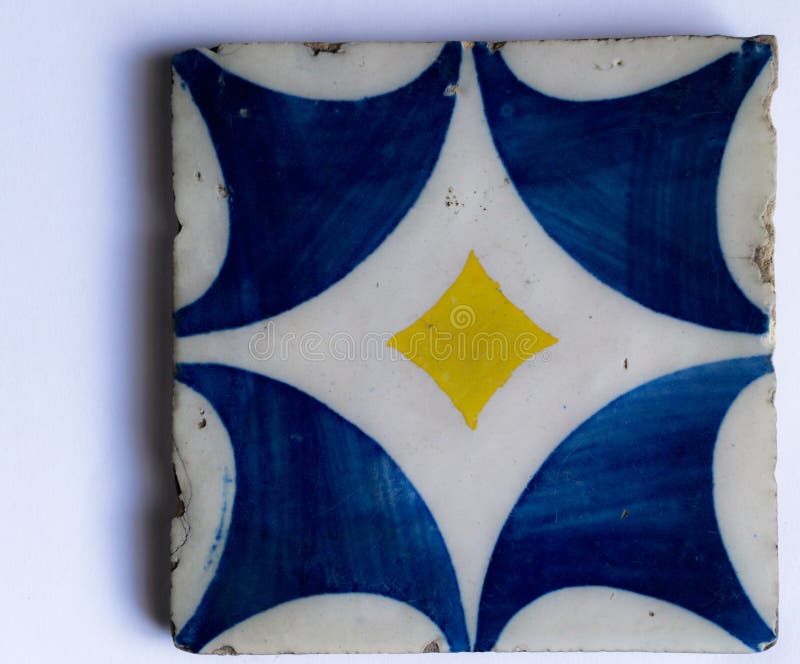 Old Decorative Tile Showing a Blue and Yellow Pattern Stock Image ...