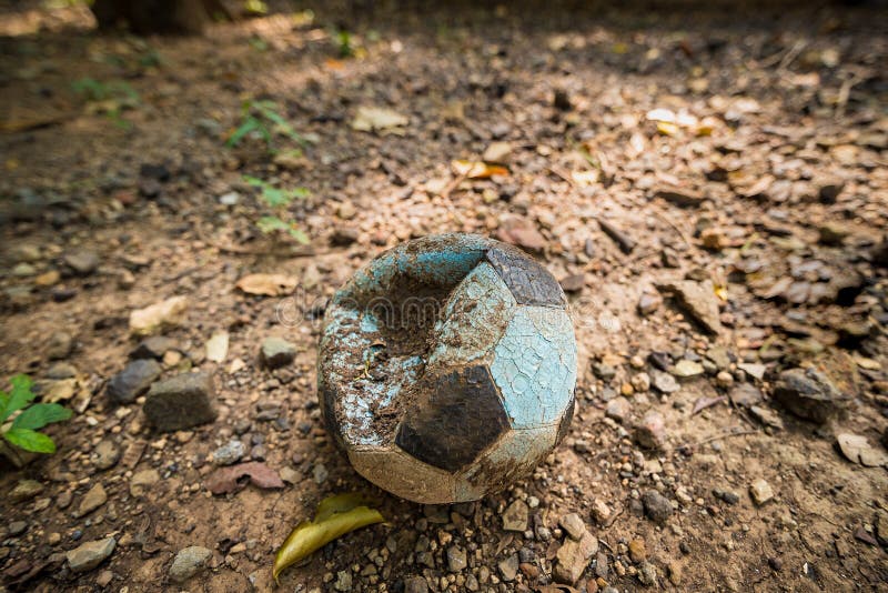 Old Deflated Soccer Ball on the Field.Thailand. Stock Photo - Image of ...