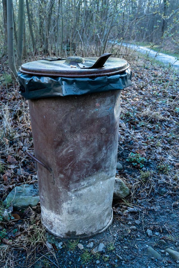 Old, Deformed, Rusty Metal Trash Can in Remote Rural Area. Thick ...