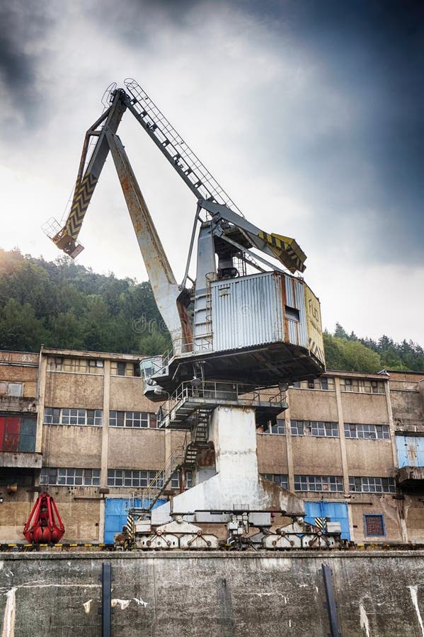 Old derrick near river stock photo. Image of equipment - 143886488