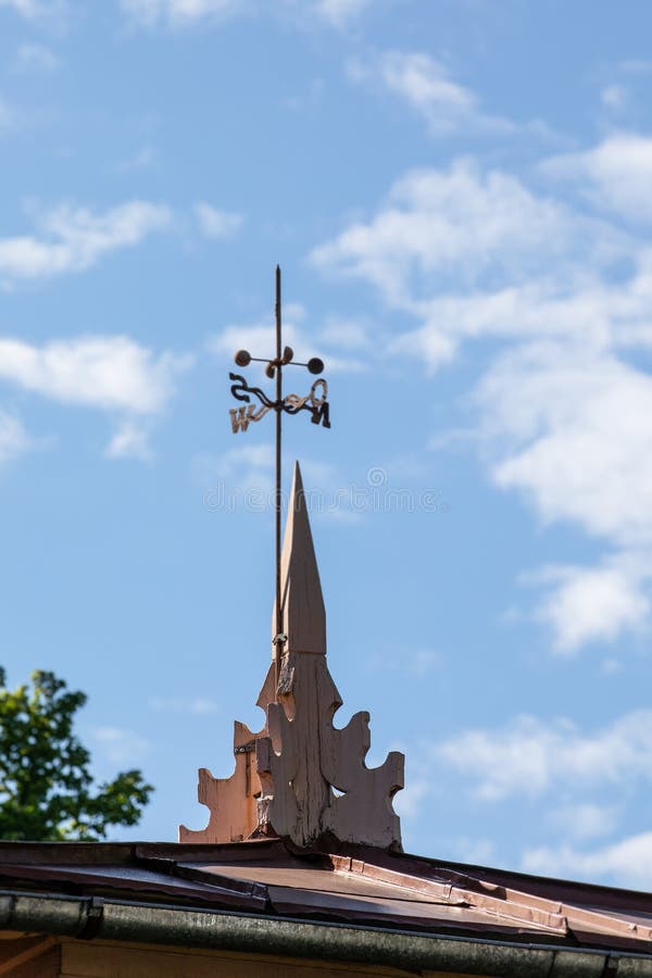 An Old Design Wind Indicator on the Roof of a House. Stock Image ...