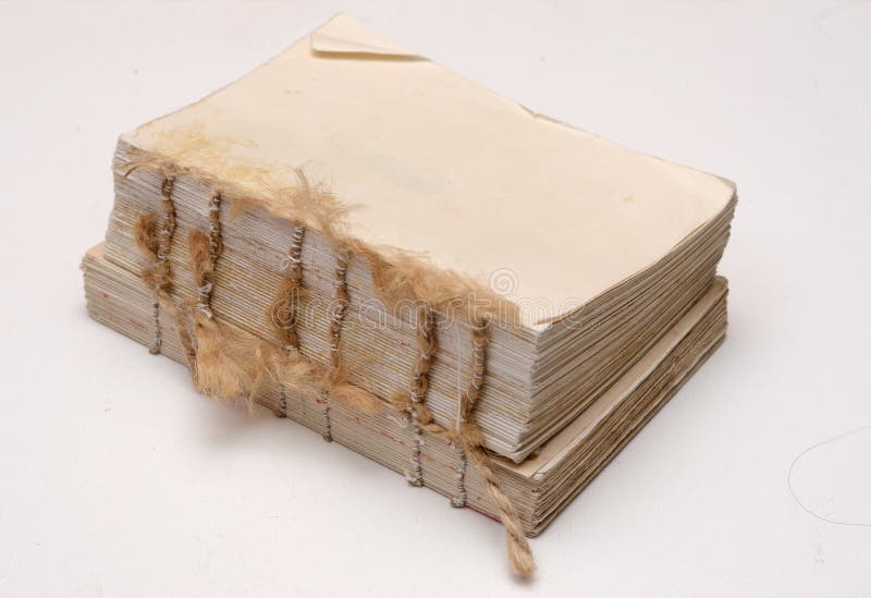 Old Destroyed Book on a White Table. Old-style Cover Stock Photo ...
