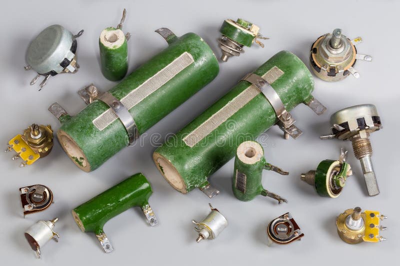 Old Different Fixed, Variable and Adjustable Resistors on a Gray ...