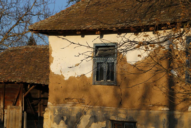 An Old, Dilapidated, Mud House with an Open Blue Window Stock Image ...